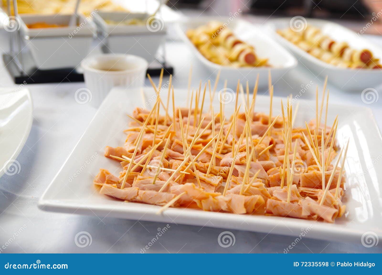 Small Pieces of Ham Canapes Lined Up on White Plate Stock Photo - Image ...