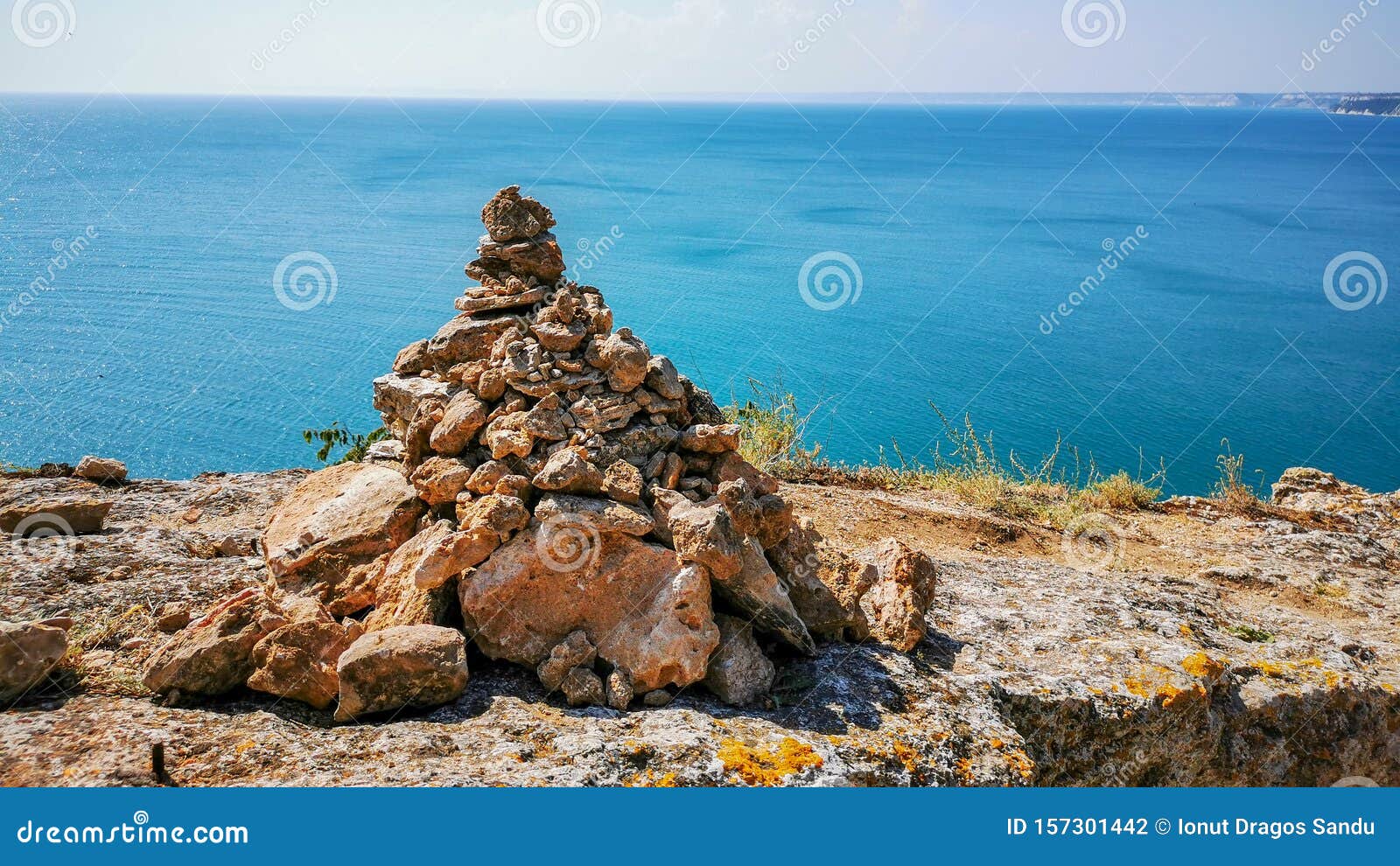 Small Pile of Rocks in the Shape of a Mountain on the Edge of a Cliff ...