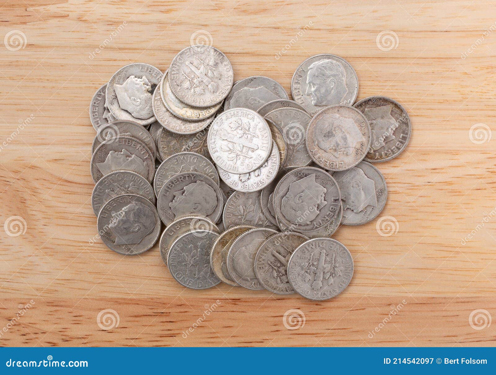 Small Pile of Silver Dimes on a Wood Table Stock Image - Image of wood ...