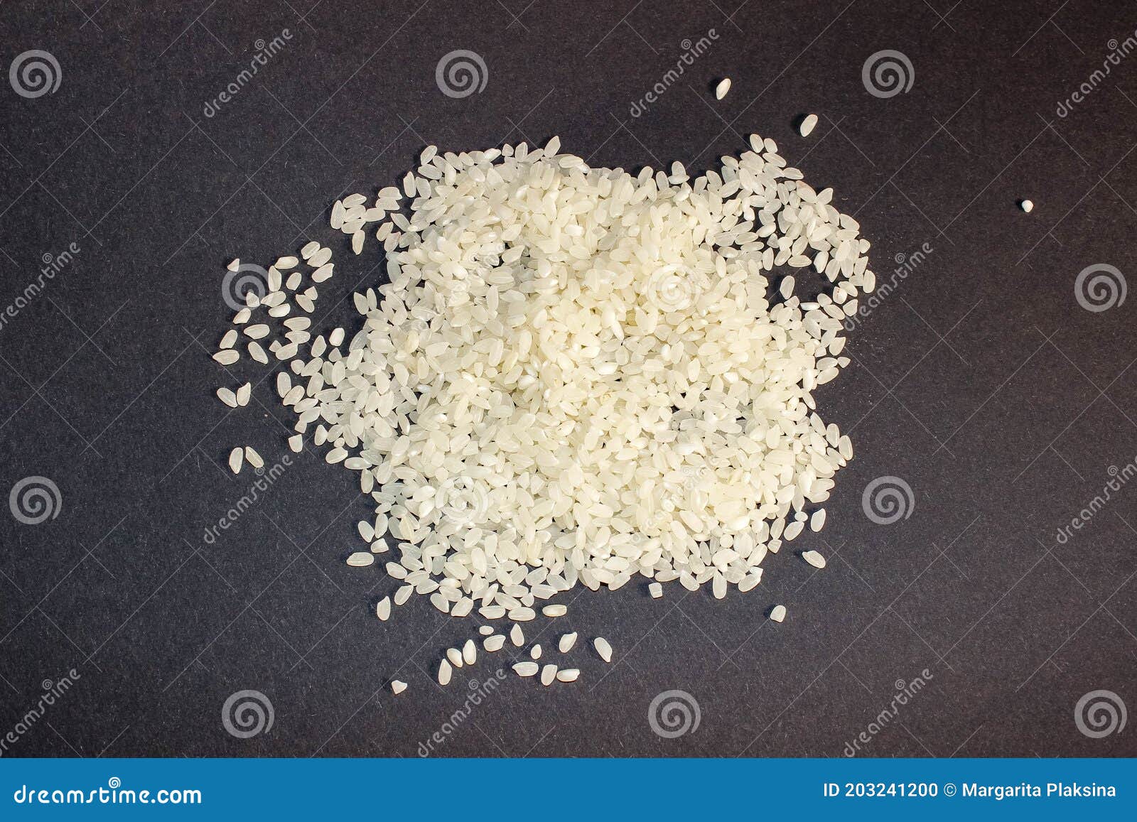 A Small Pile of White Round Rice on a Black Background Stock Photo ...