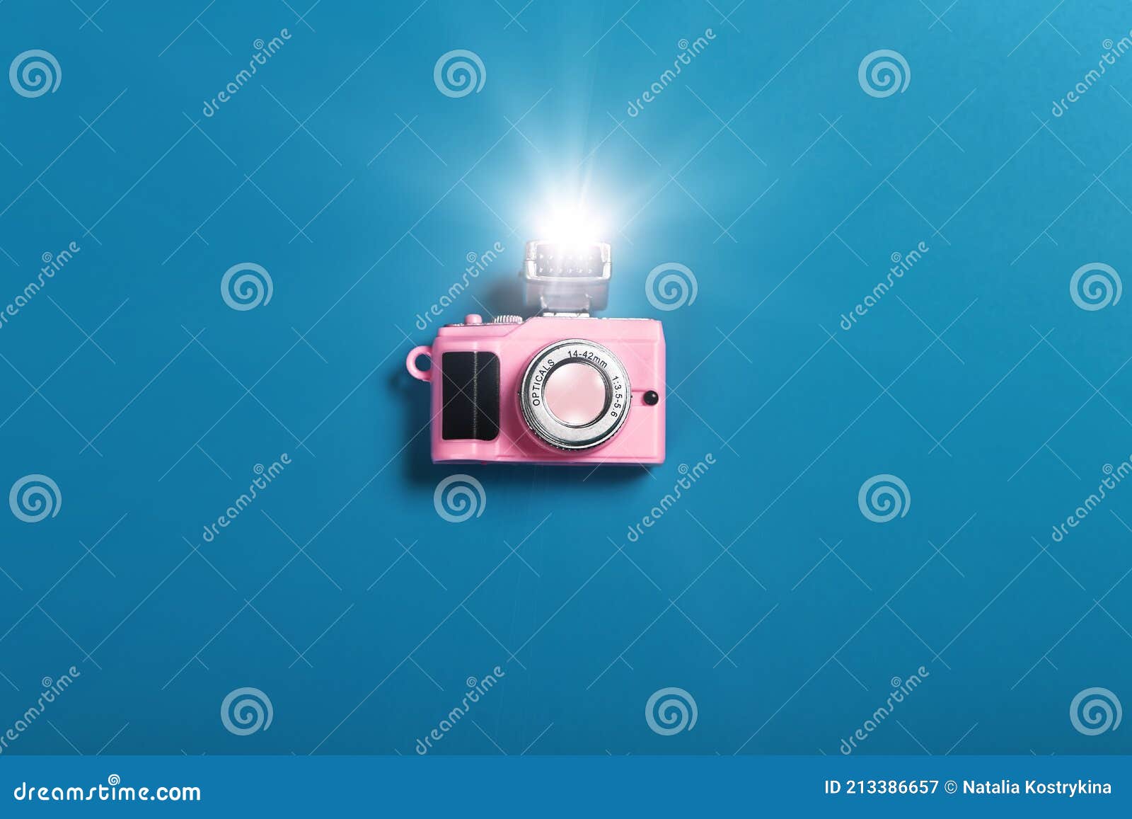 Small Pink Camera with Flash on Blue Background Stock Image - Image of ...