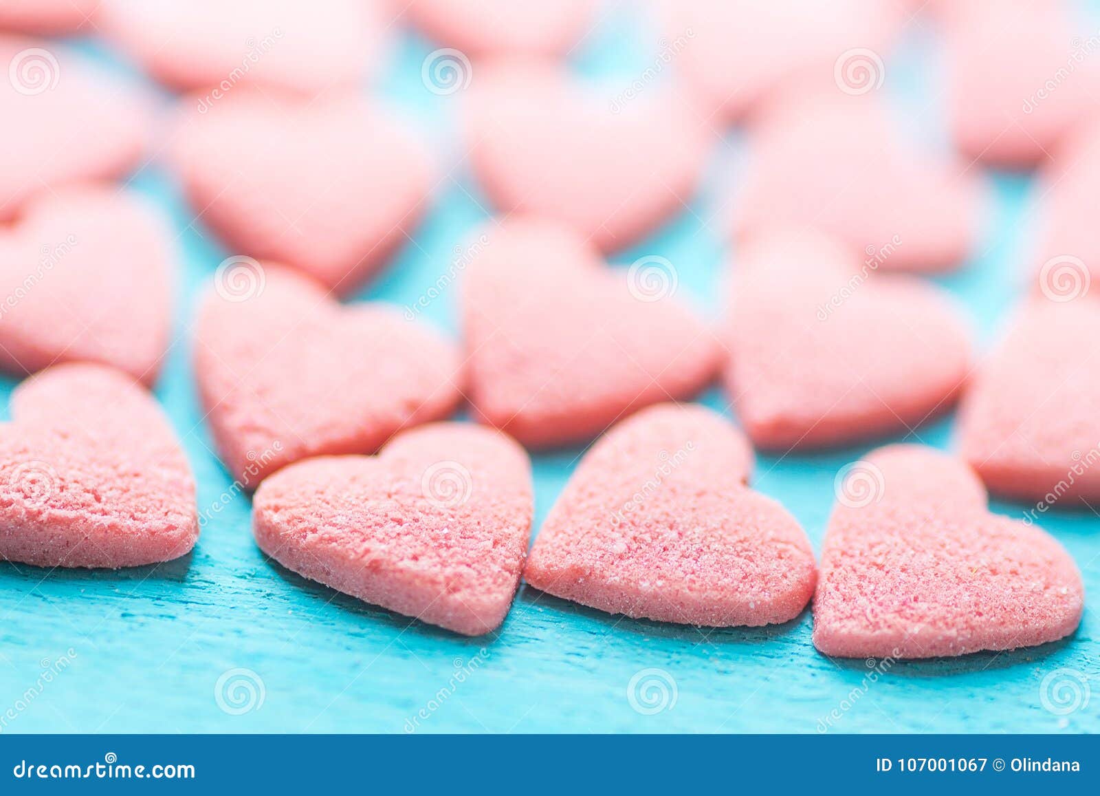 Small Pink Sugar Candy Sprinkles Spilled Scattered on Light Blue ...