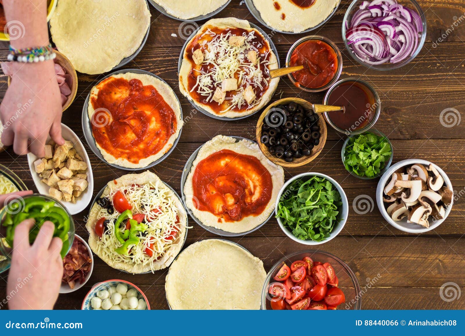 Small pizzas stock photo. Image of traditional, hands - 88440066