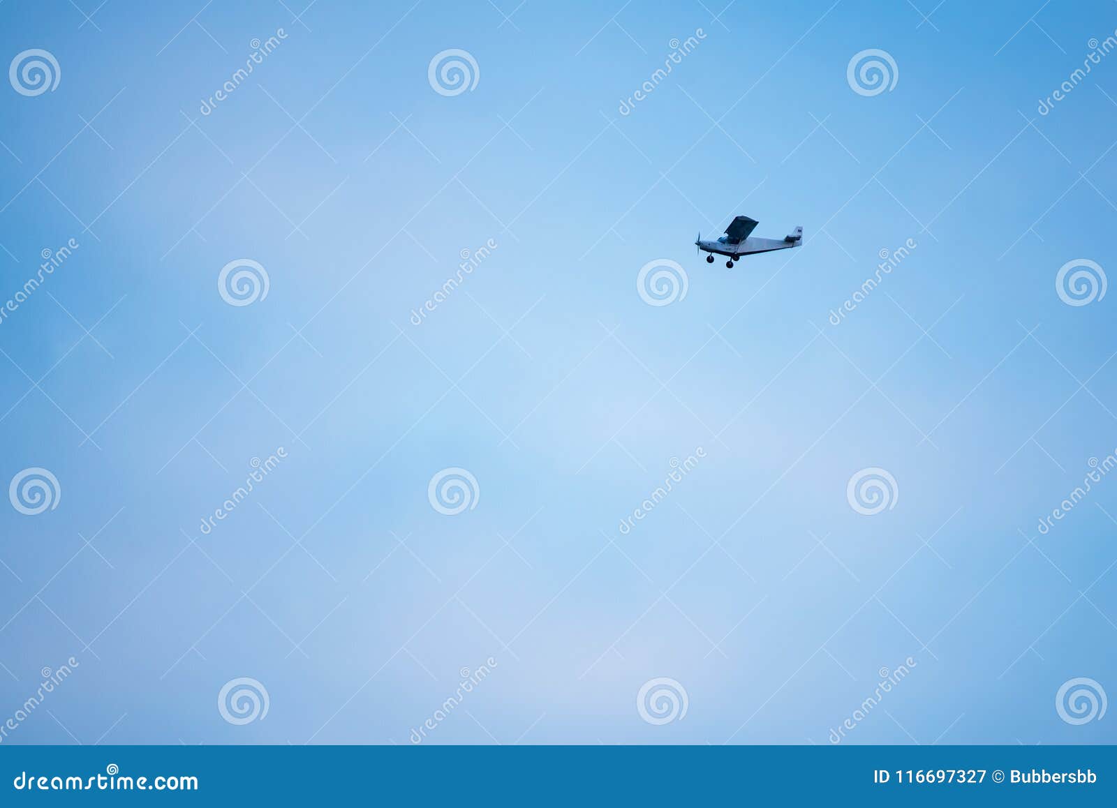 Small Plane in the Air. Blue Sky with White Clouds. Stock Image - Image ...