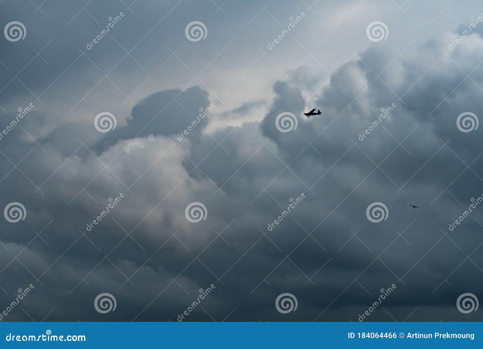 Small Plane in Cloudy Sky for Rainmaking. White Fluffy Clouds with ...