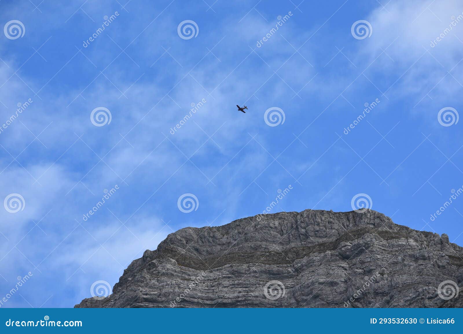 Small Plane Flies Over a Rock Stock Photo - Image of weather, aircraft ...