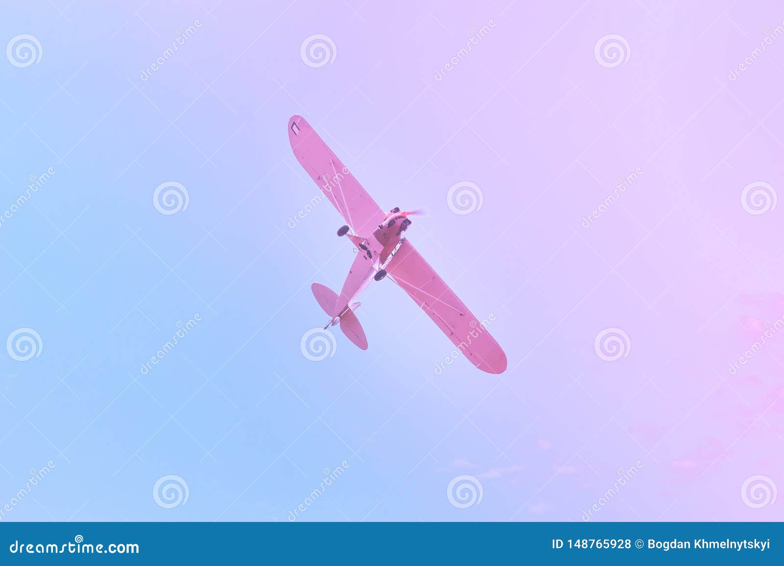 Small Plane Flying Against the Blue, Purple, Pink Sky Stock Photo ...