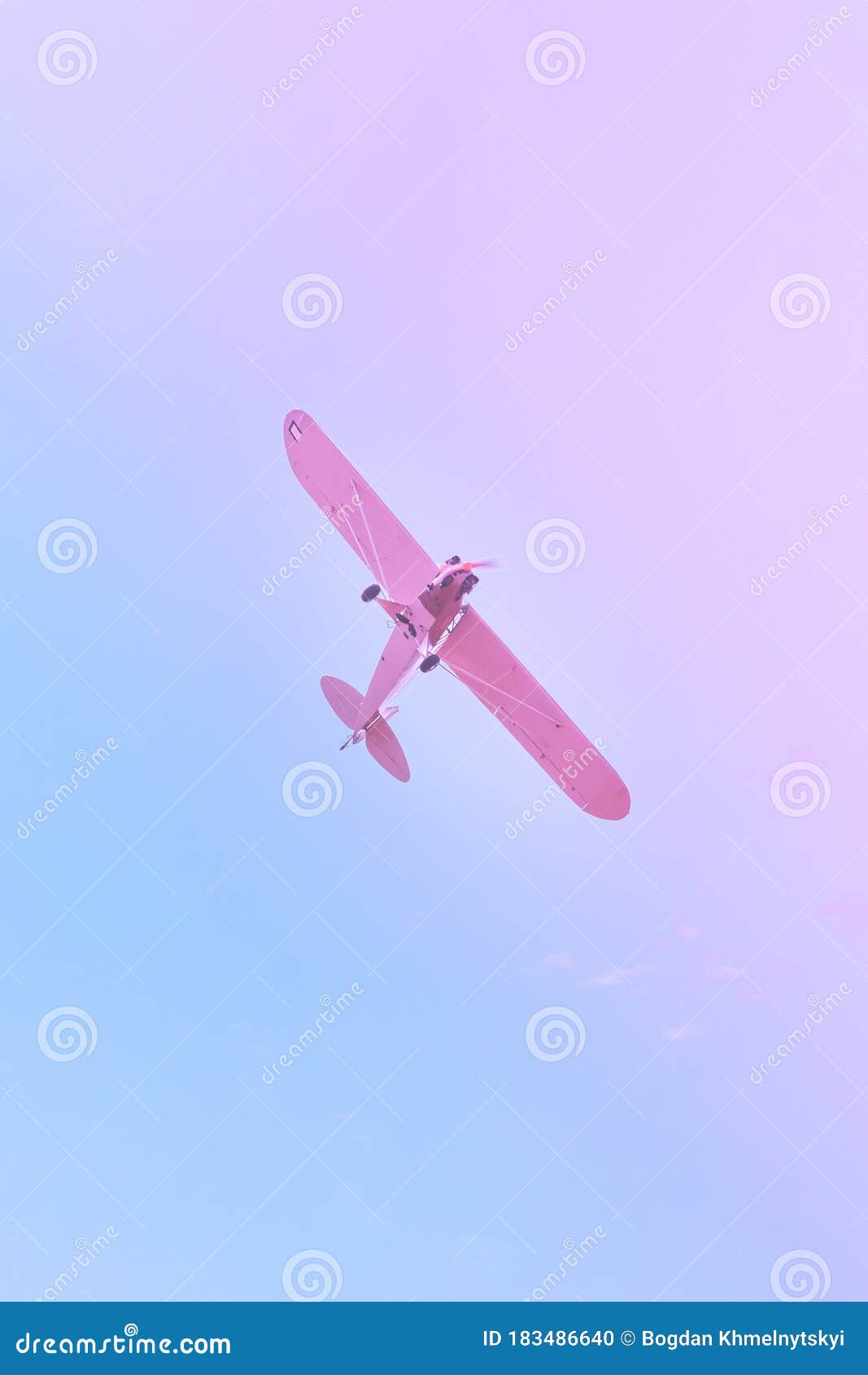 Small Plane Flying Against the Blue, Purple, Pink Sky Stock Photo ...