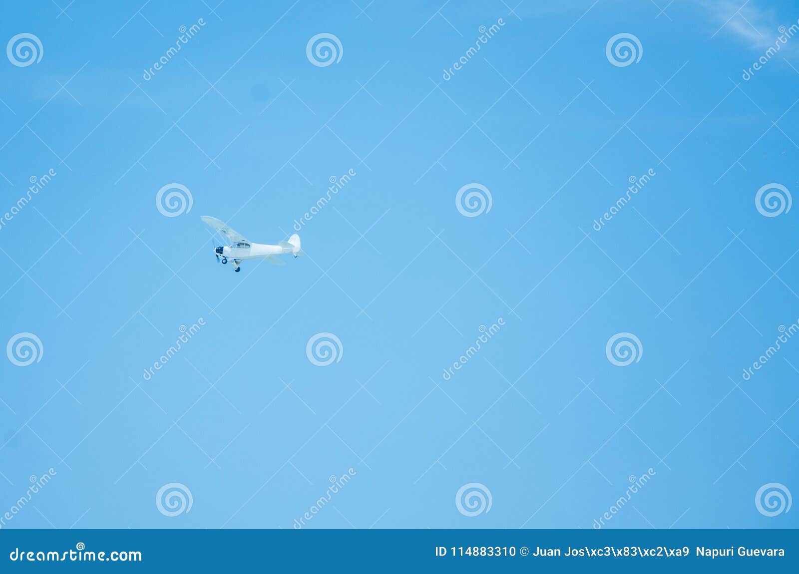 A small plane in the sky stock photo. Image of airplane - 114883310