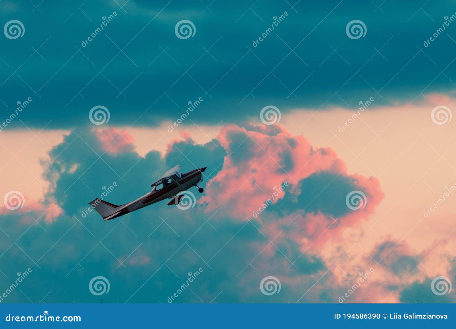 Small plane taking off stock photo. Image of sunset - 194586390