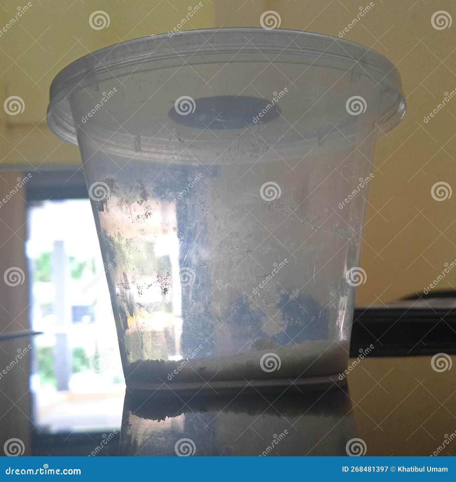 Small Plastic Mica Container with Remaining Powdered Sugar in it Stock ...