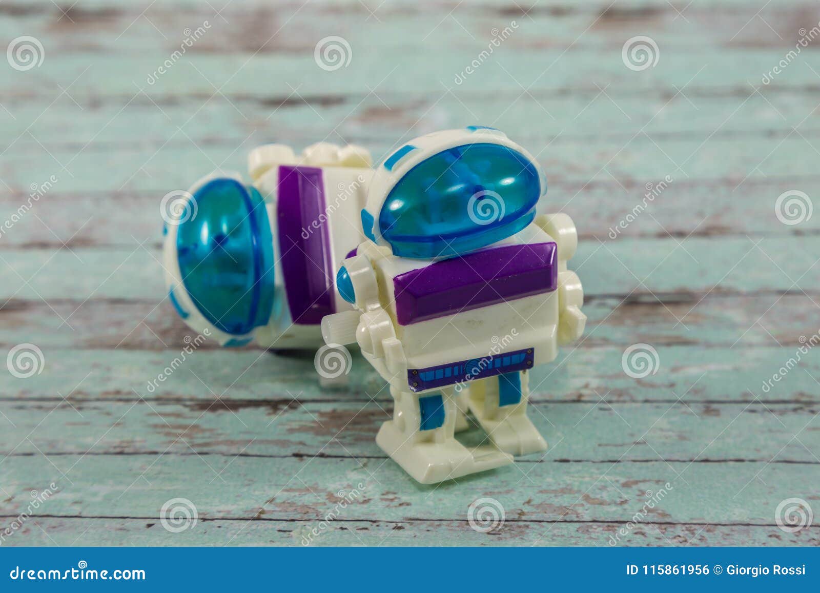 Small Plastic Robot Toys on White Wooden Table Stock Photo - Image of ...