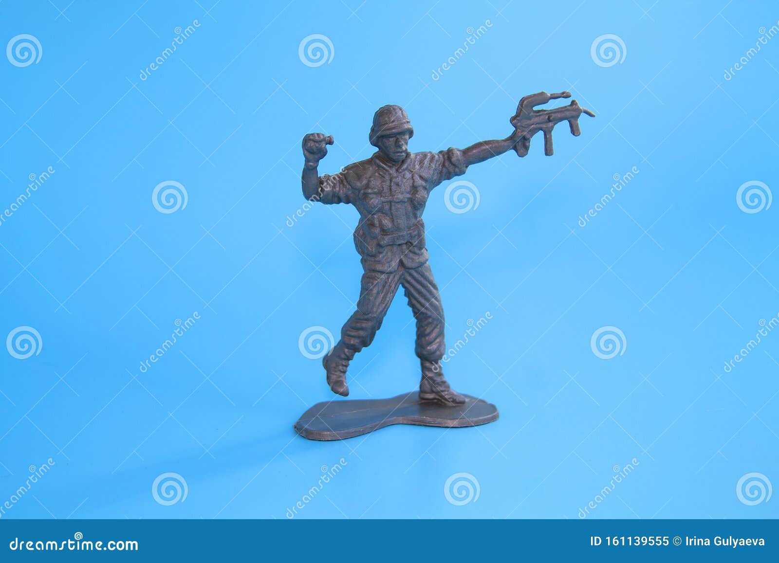 Small Plastic Soldiers Standing on a Blue Background Stock Image ...