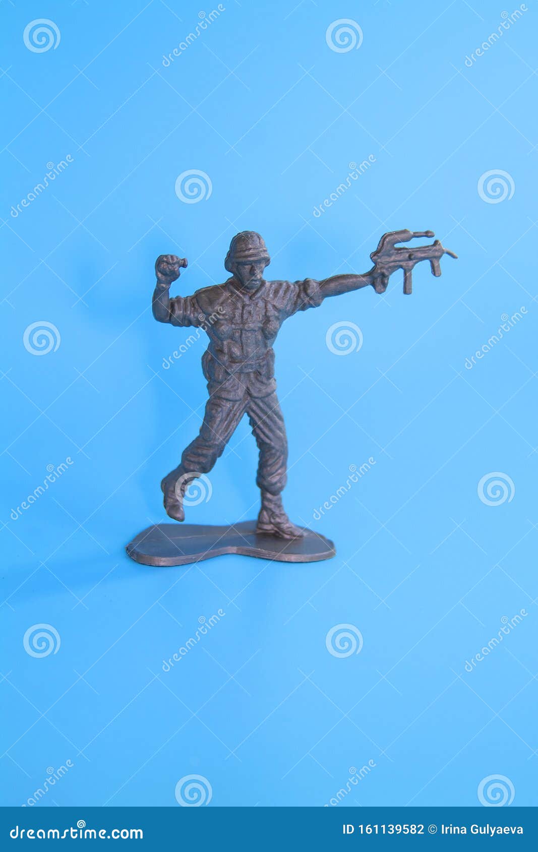 Small Plastic Soldiers Standing on a Blue Background Stock Photo ...