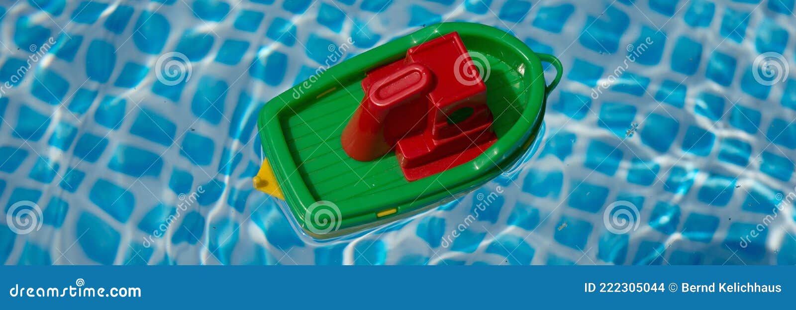 Small Plastic Toy Boat Floating in a Swimming Pool. Panorama Stock ...