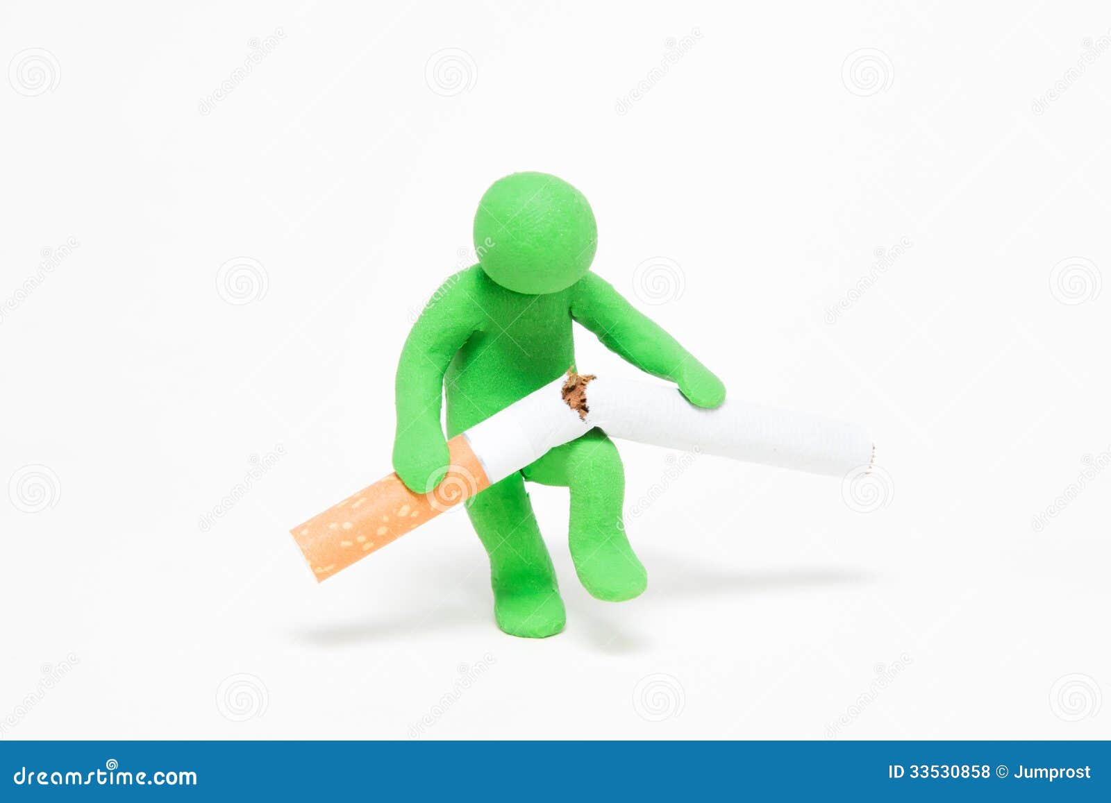 Small Plasticine Puppet Breaks a Cigarette Stock Photo - Image of green ...