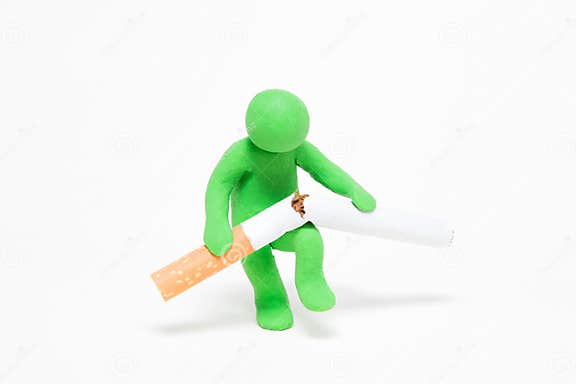 Small Plasticine Puppet Breaks a Cigarette Stock Photo - Image of green ...