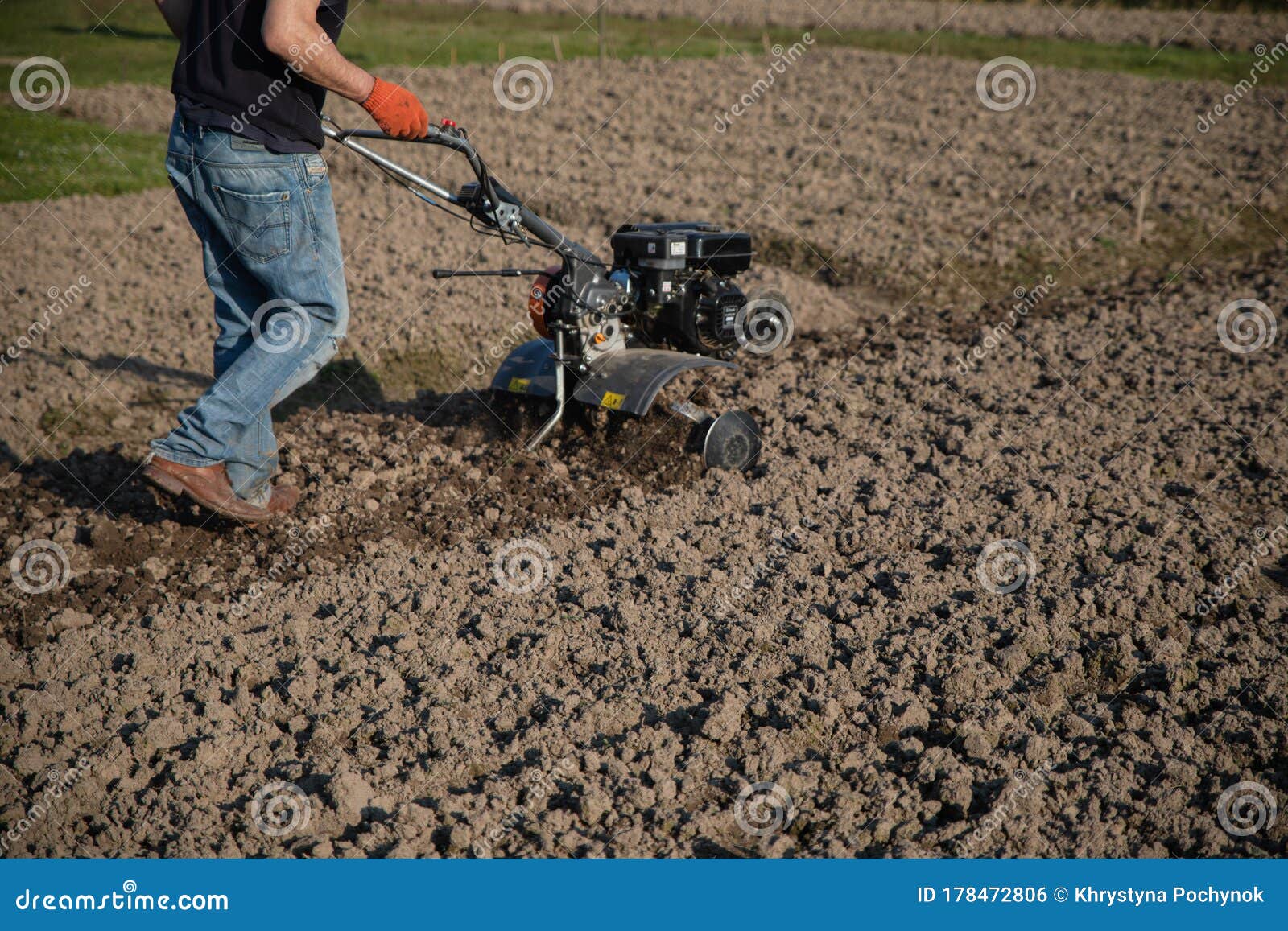 Small Plowing Machine in Hands of a Farmer Making Arable in Black Soil ...