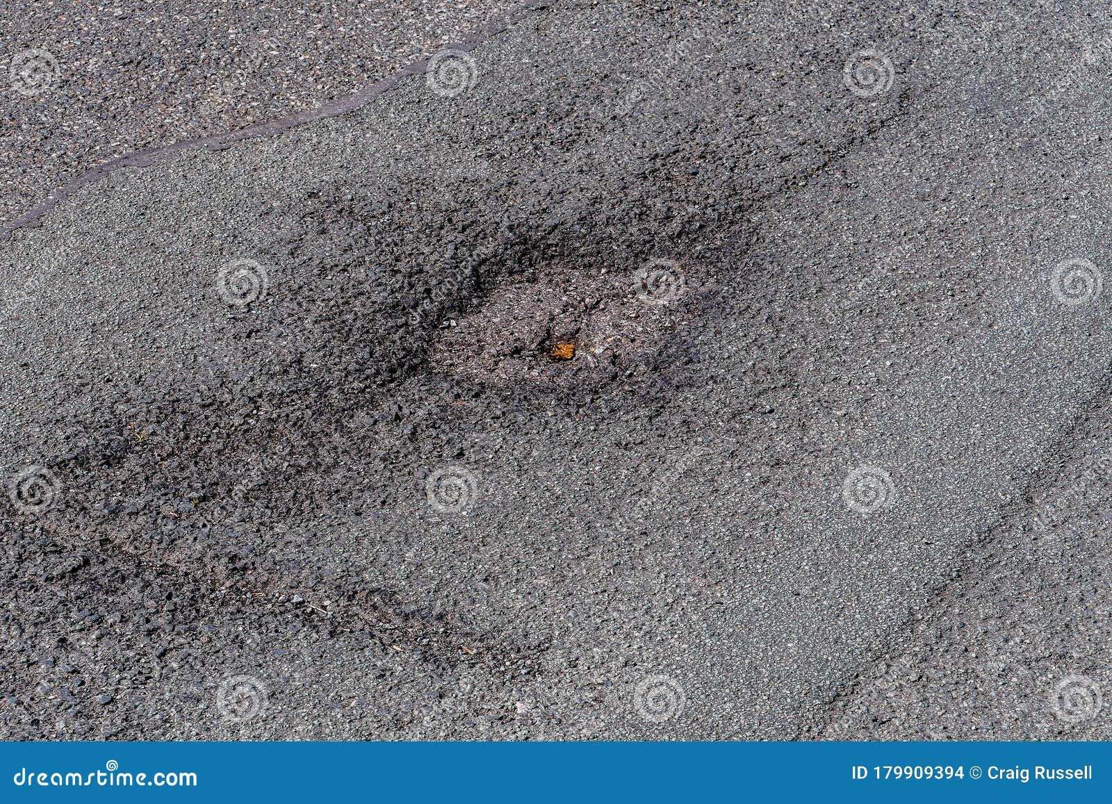 Small pothole in a road stock photo. Image of surface - 179909394