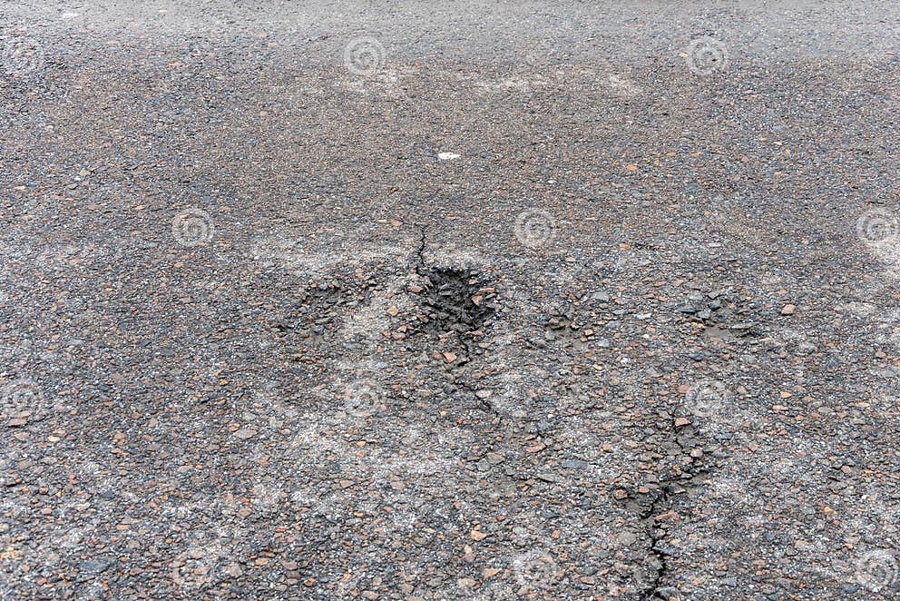Small Potholes on the Asphalt Road, Pits and Destroyed Road Surface ...