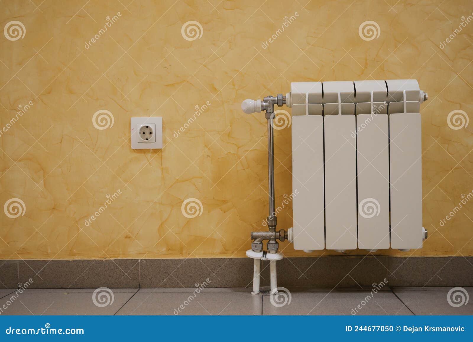 Small Radiator and Electrical Socket Stock Photo - Image of socket ...