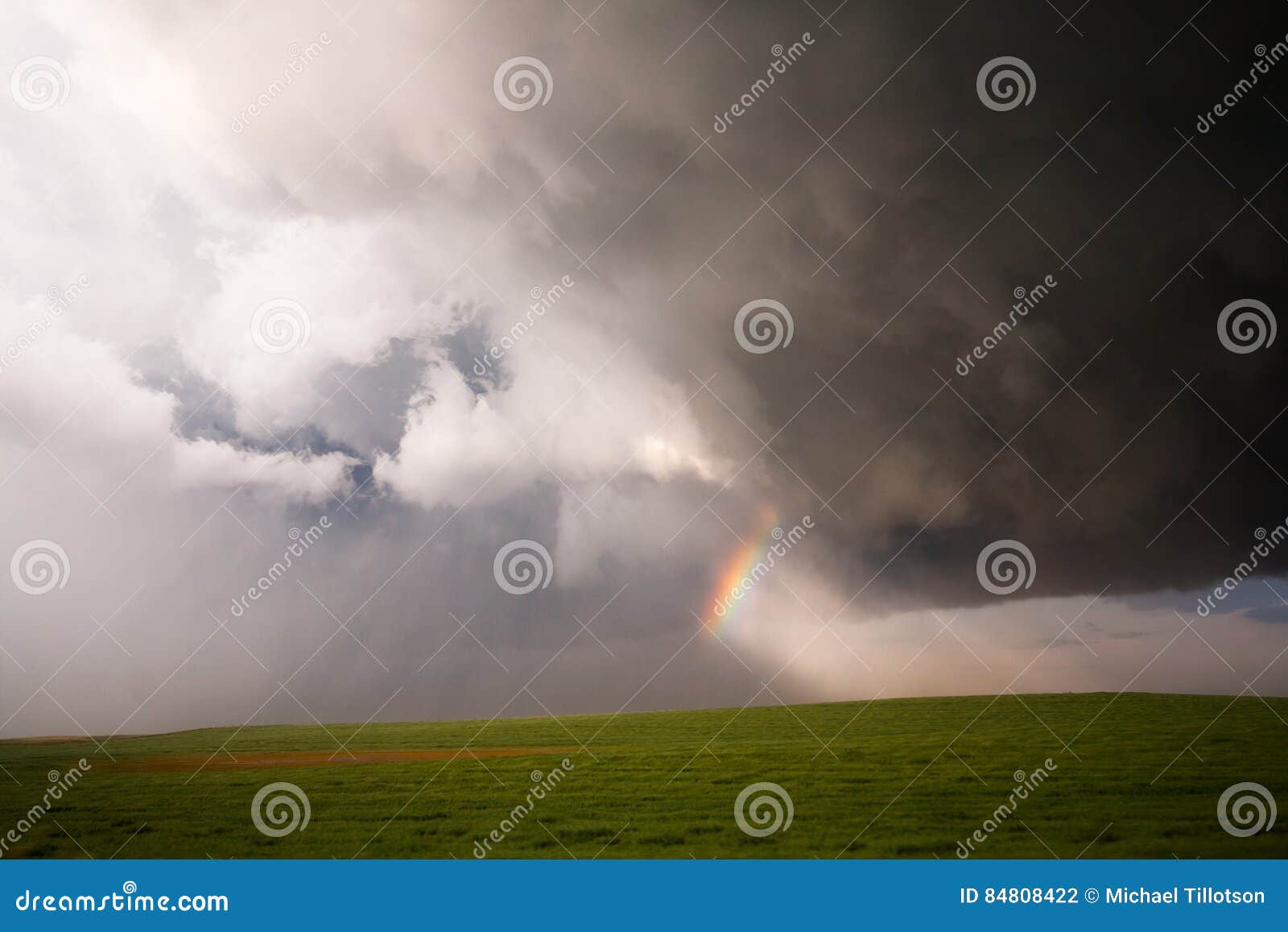 Small Rainbow & Storm Clouds Stock Photo - Image of clouds, glows: 84808422