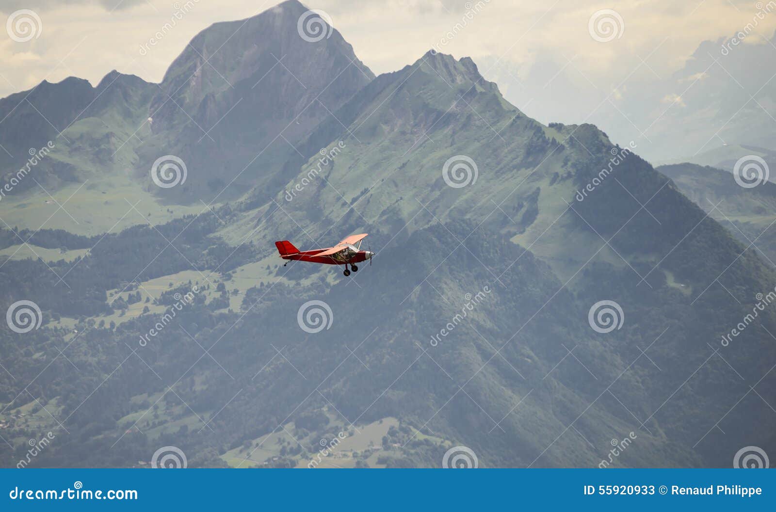 A Small Red Airplane Flying Over the Alps Stock Image - Image of flying ...