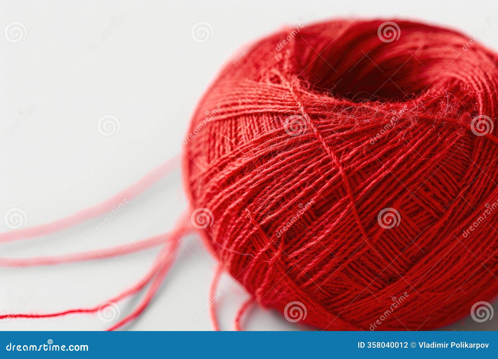 A Small Red Ball of Yarn on a Plain White Background Stock Photo ...