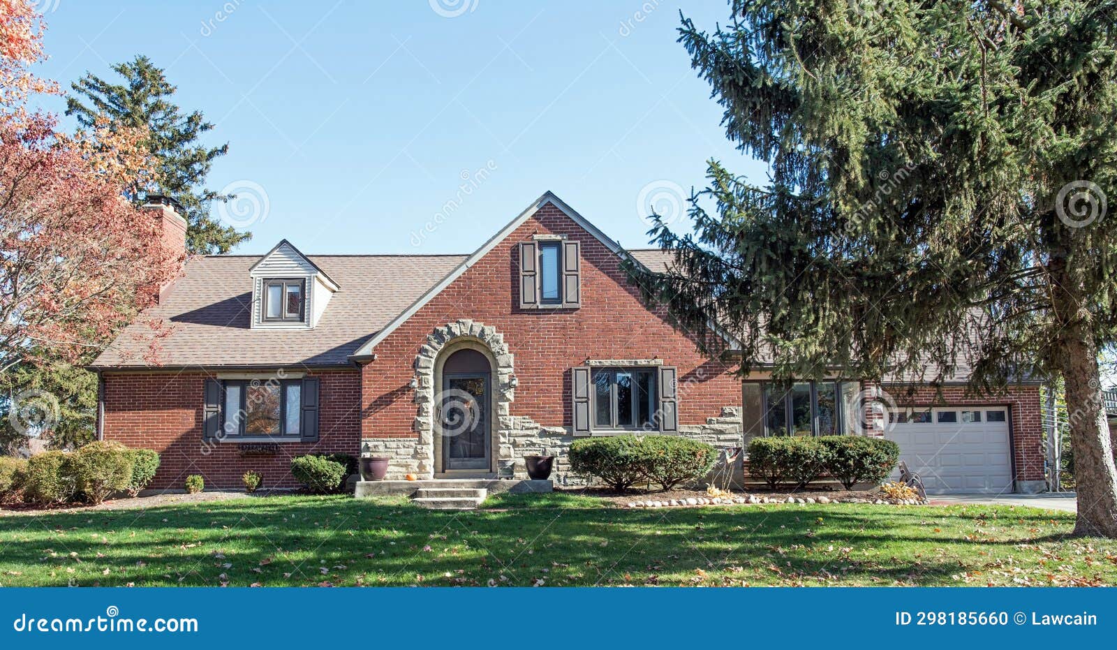 Small Red Brick House with Stone Arch Over Door Stock Photo - Image of ...