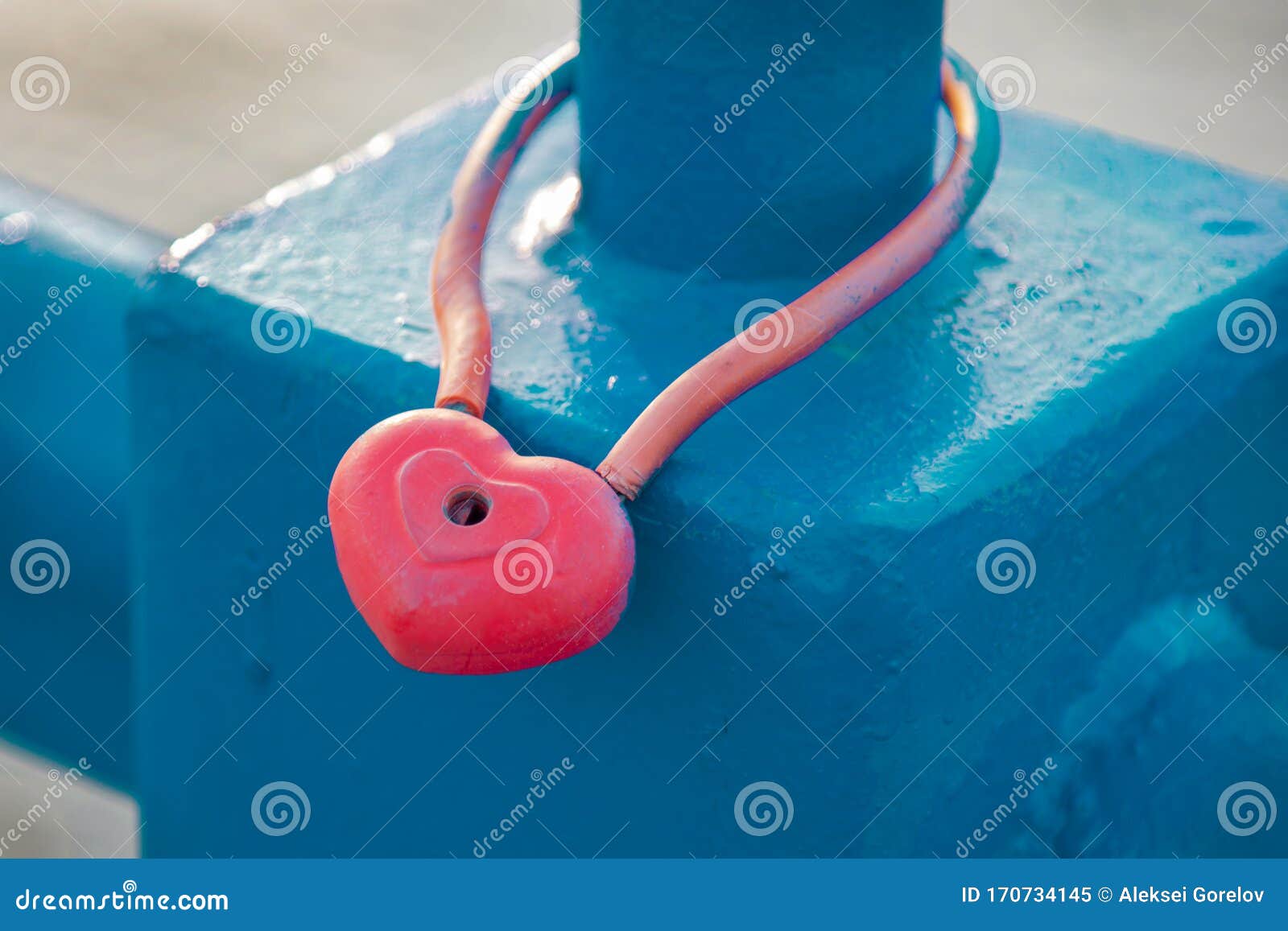 Red Castle Hanging on an Iron Blue Railing Stock Image - Image of ...