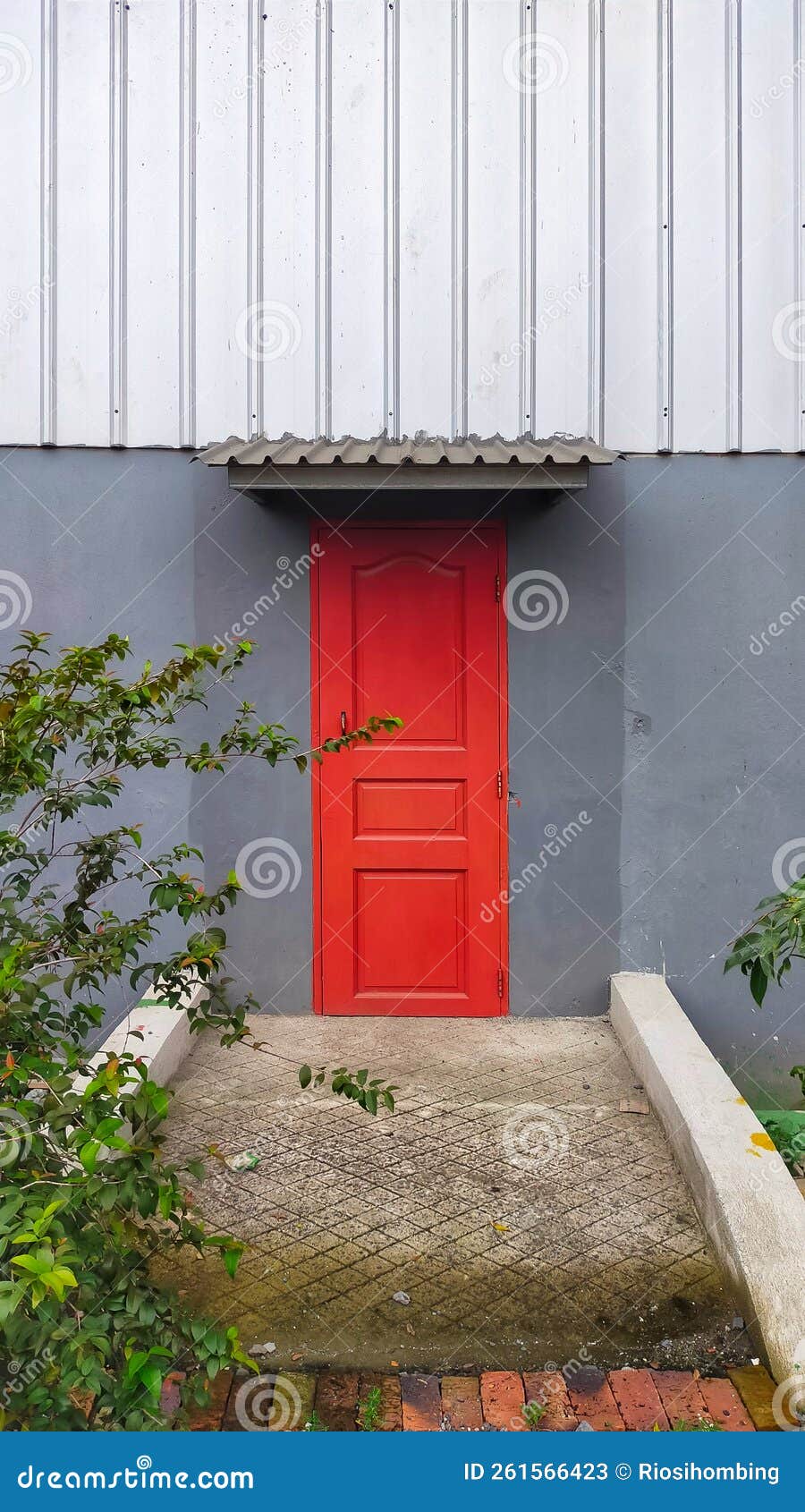 A Small Red Door and a Small Bridge Pathway To the Door Stock Image ...