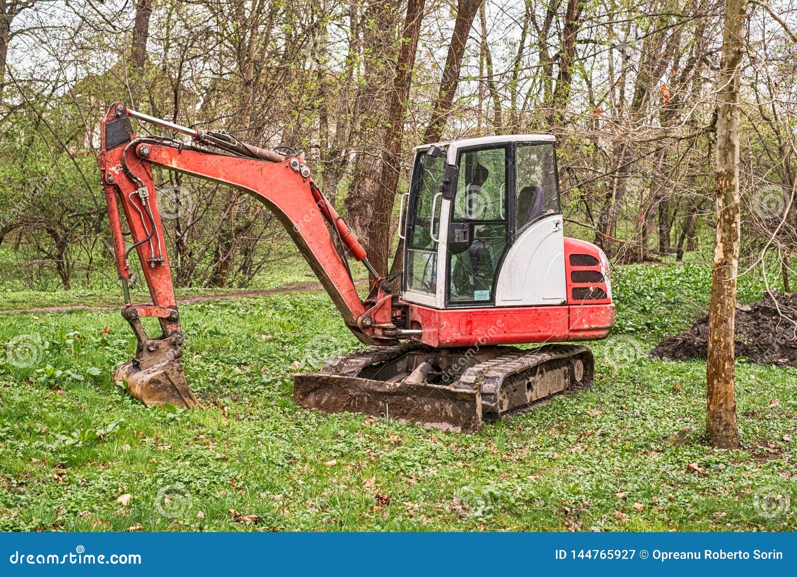 A Small Red Excavator in the Woods Stock Image - Image of industrial ...