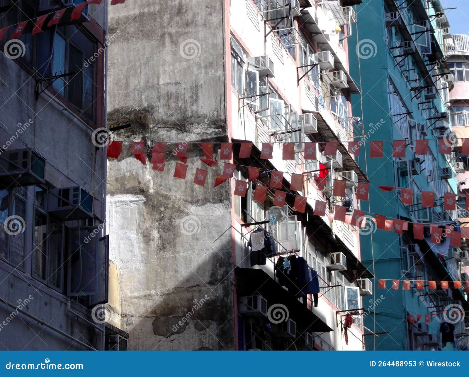 Small Red Flags Hanging from the Buildings in the Urban Area Stock ...