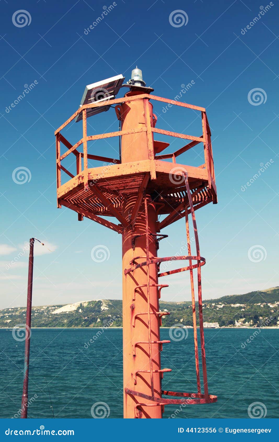 Small Red Lighthouse Pole on the Coast of Sea Stock Photo - Image of ...