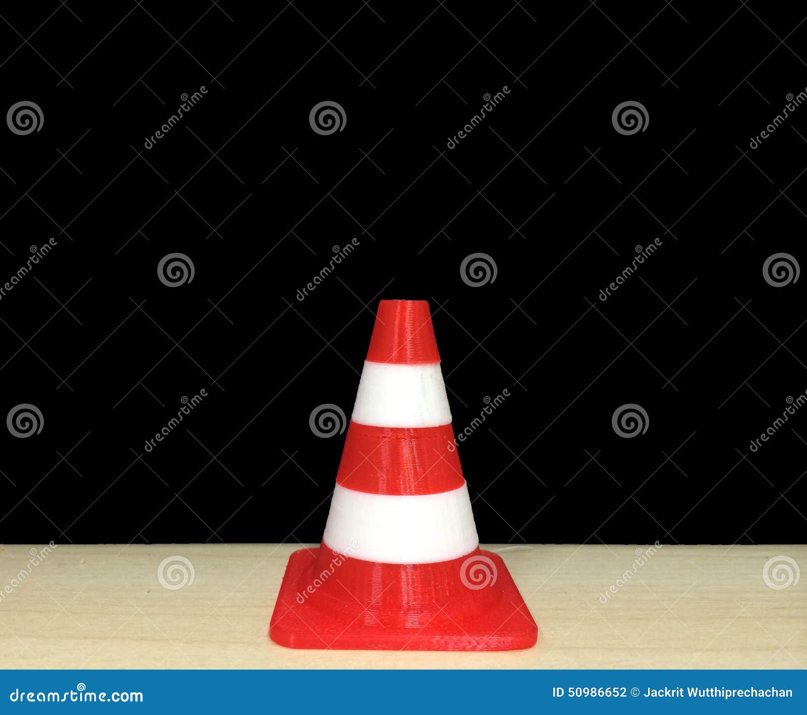 Small Red and White Cone Model Made by 3D Printer on Wooden Table with ...