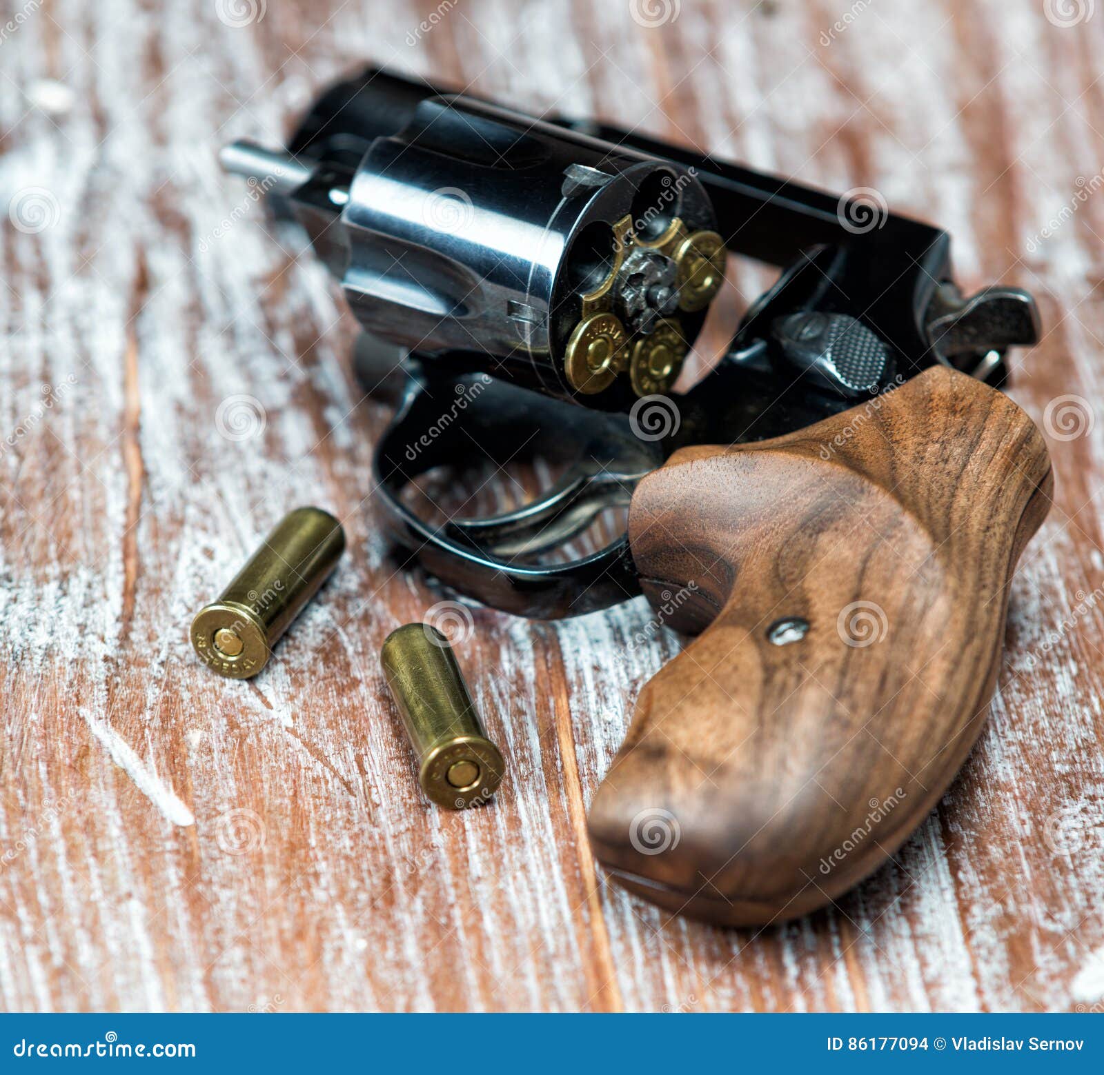 Small Revolver Lying on a Table Stock Photo - Image of bullet, army ...