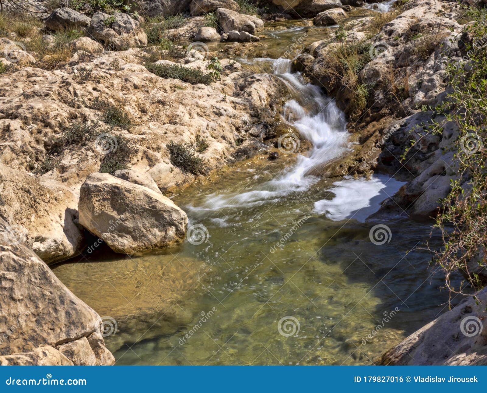 Small River with Clear Water Flowing Out of Darbat Waterfall. Oman ...