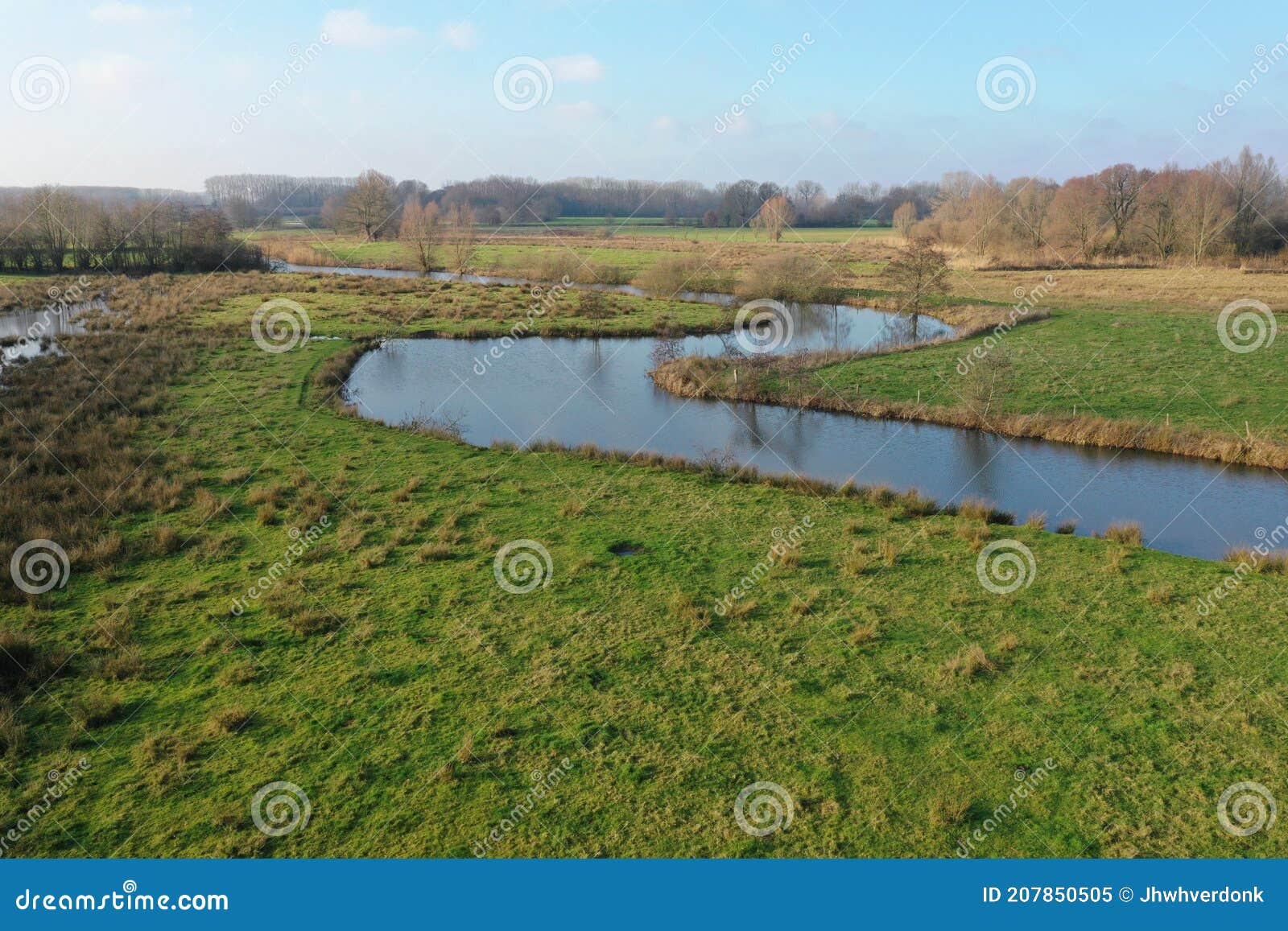 A Small River that is Meandering To the Lush Green Meadows Stock Image ...