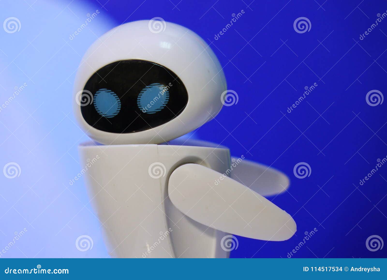 A Small Robot with a Humanoid Body on a Blue Background . Artificial ...