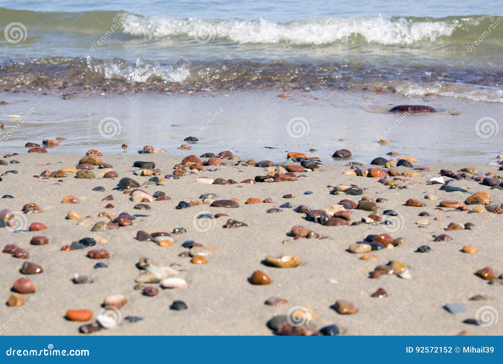 Small Rocks Scattered on Beach Sand Close Up. Stock Photo - Image of ...