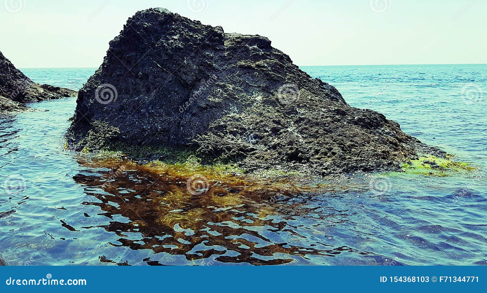 Small rocks in the sea stock image. Image of george - 154368103