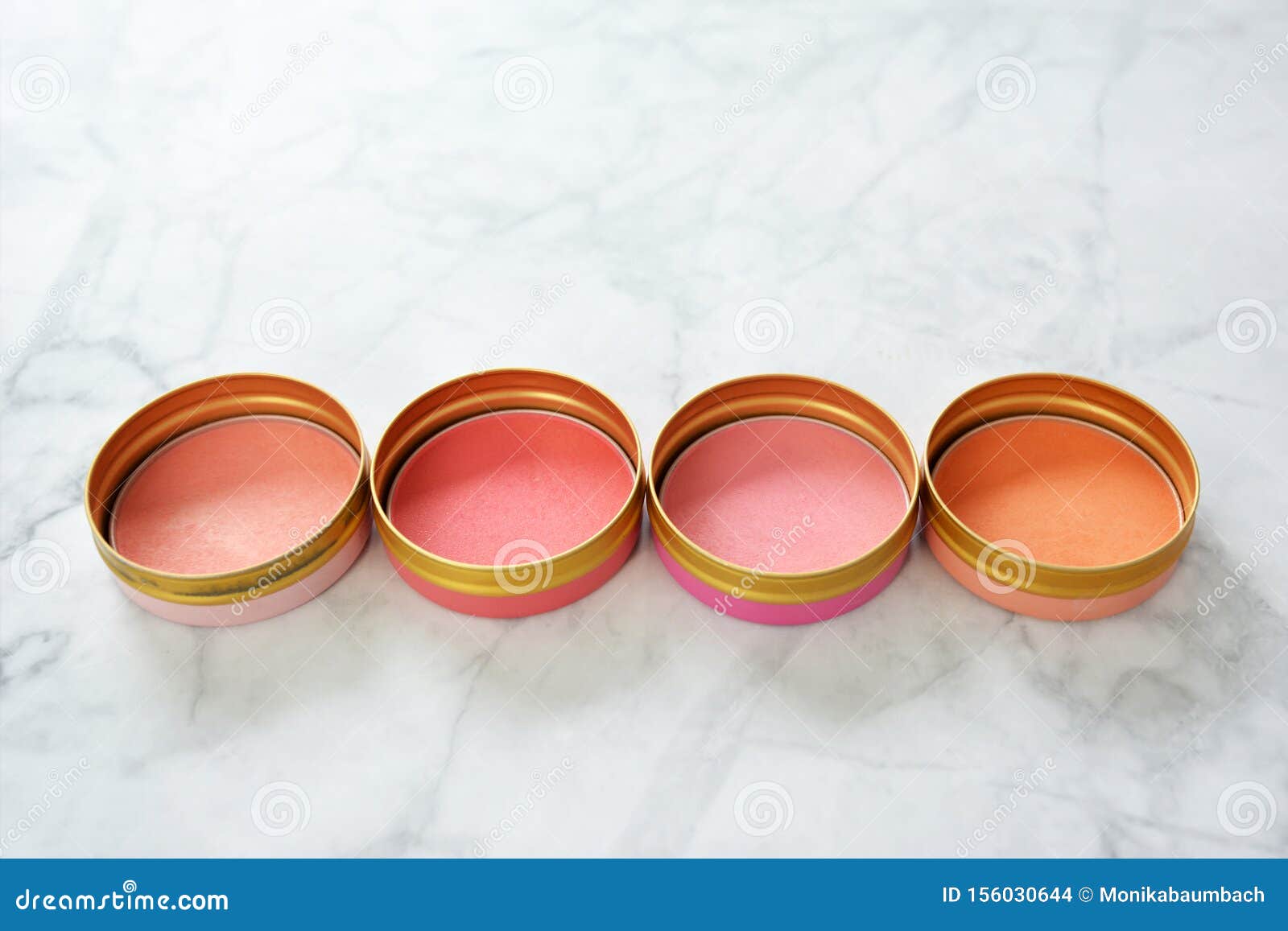 4 Small Round Blush Makeup Pots with Different Shades of Pink in a Row ...