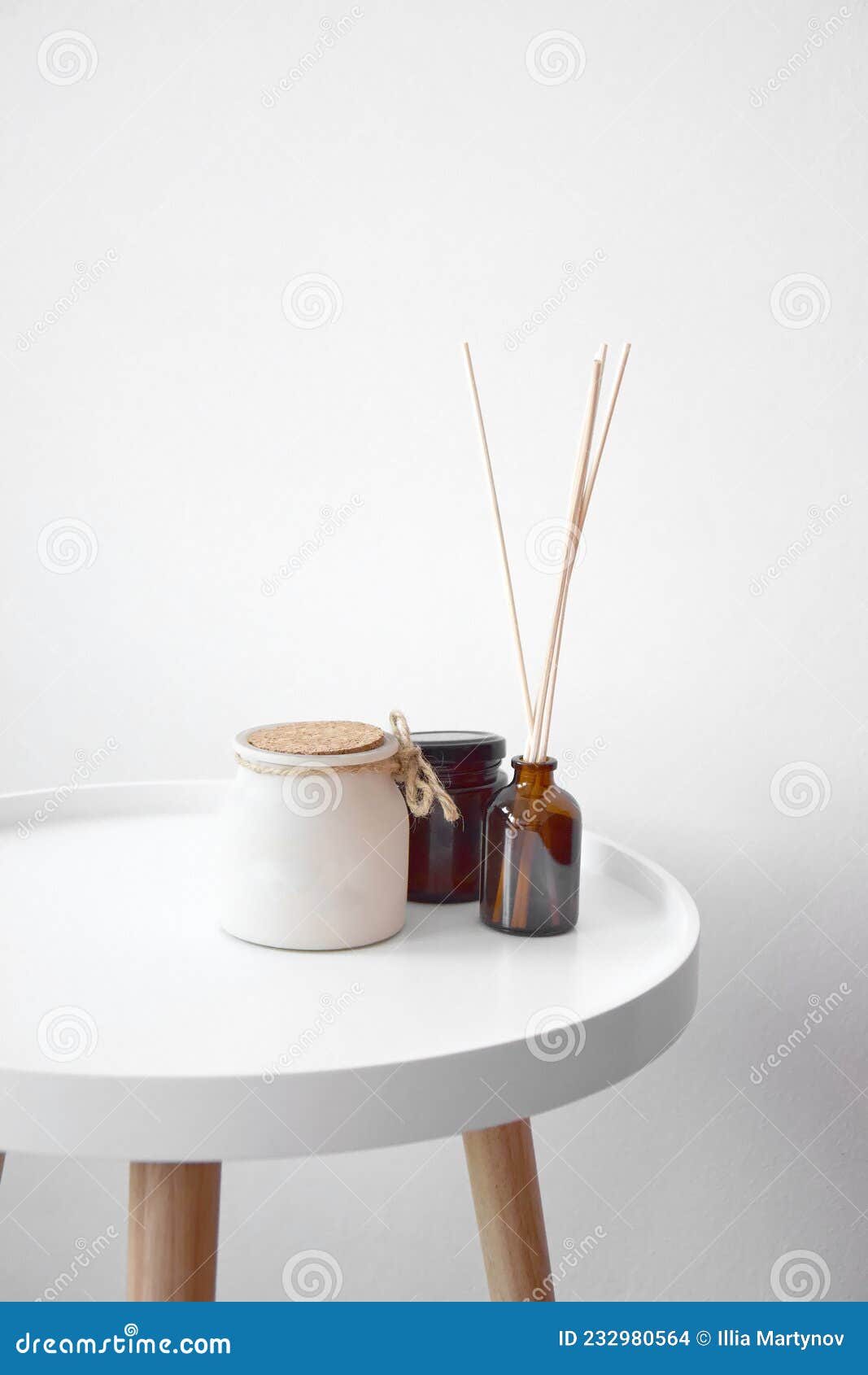 Small Round Coffee Table with a Candle and Perfume for Rooms on a White ...