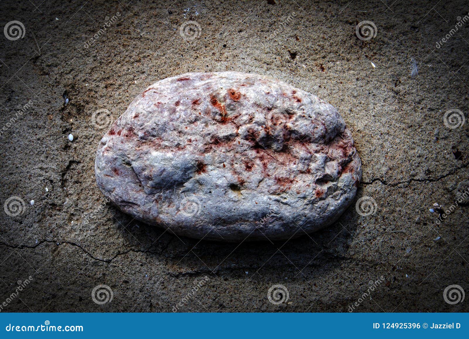 Small Round Pink Granite Stone Half Fixed in Concrete Surface Stock ...