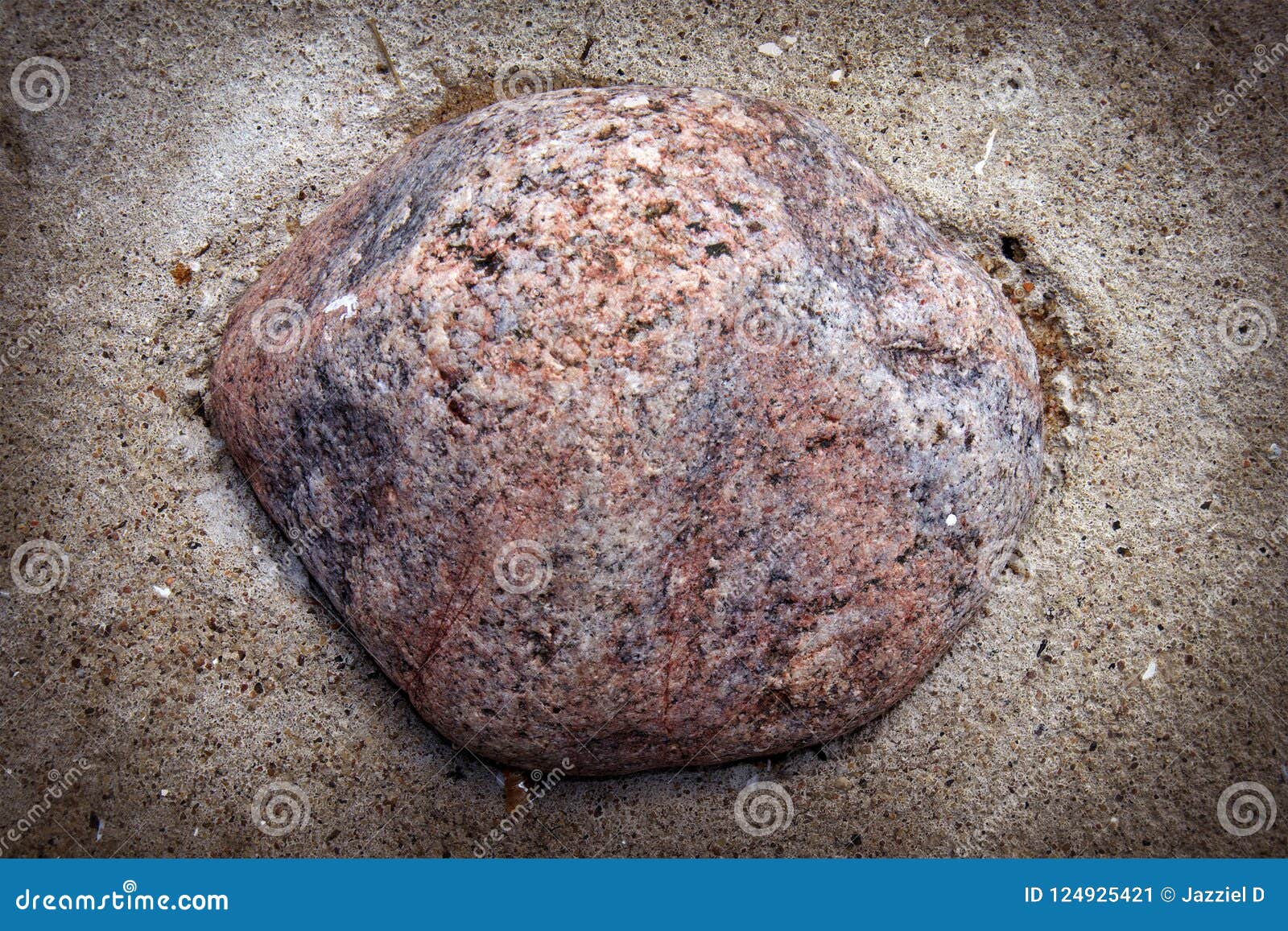 Small Round Pink Granite Stone Half Fixed in Concrete Surface Stock ...