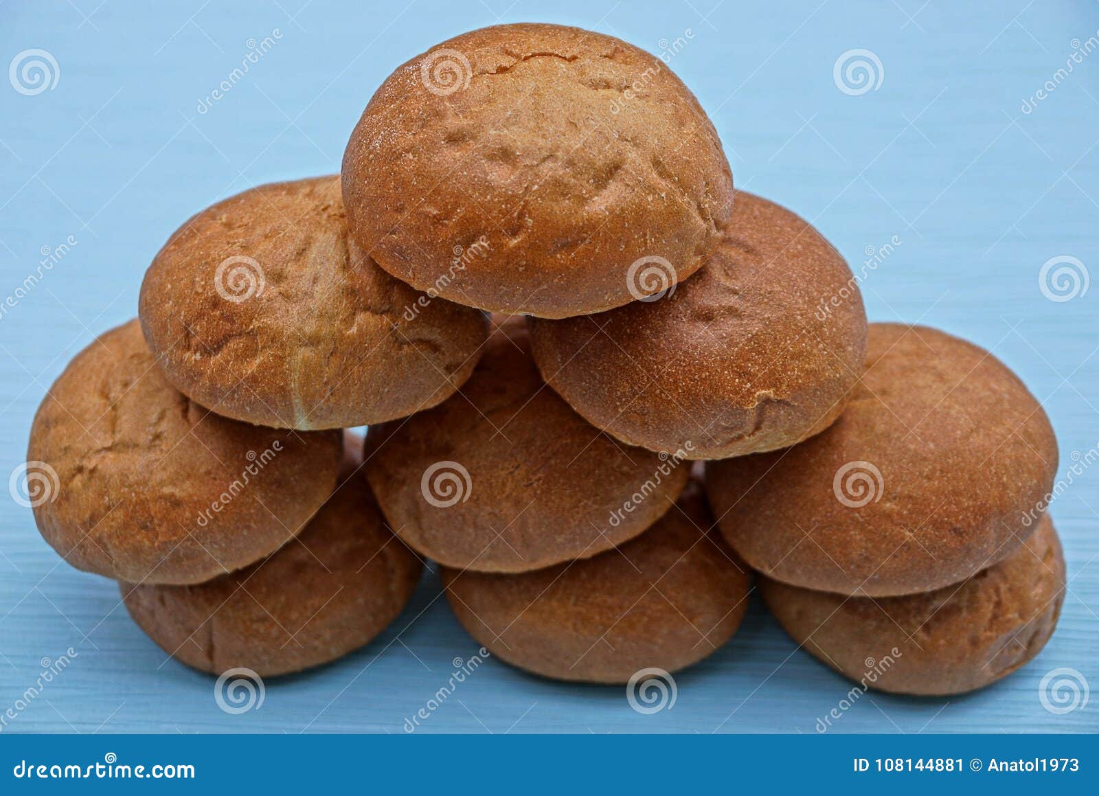 A Roll of Round Wheat Rolls on a Table Stock Image - Image of dough ...