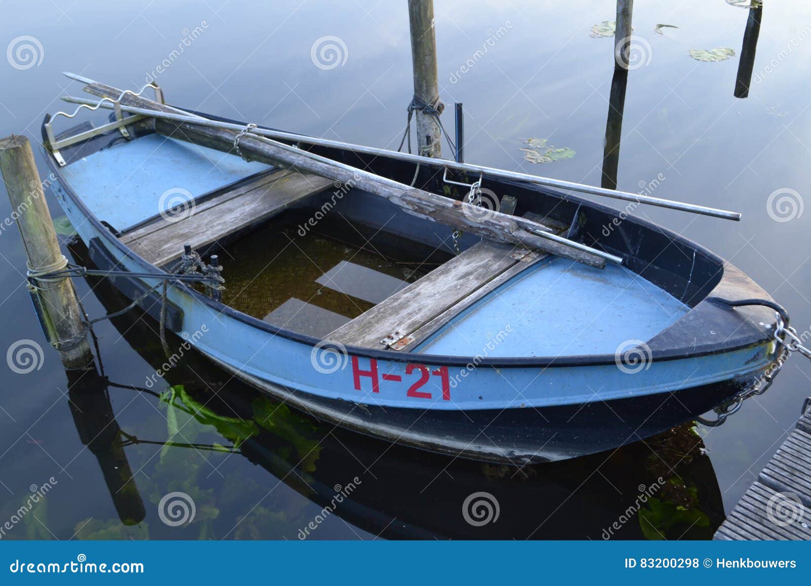 Small rowing boat in water stock photo. Image of small - 83200298