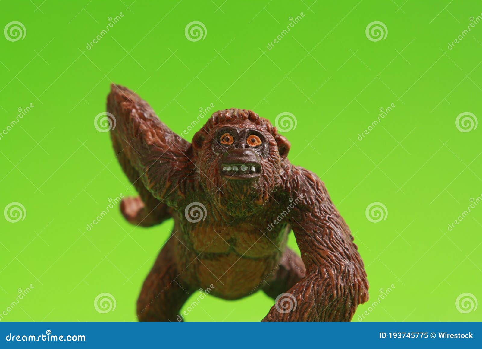 Small Rubber Ape Toy Isolated on a Green Background Stock Image - Image ...
