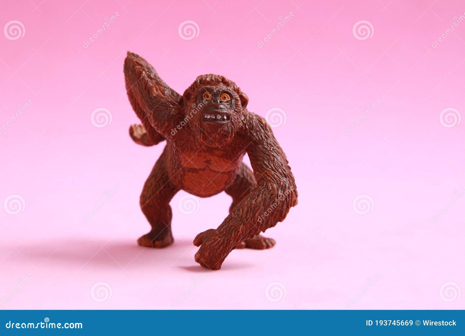 Small Rubber Ape Toy Isolated on a Pink Background Stock Image - Image ...
