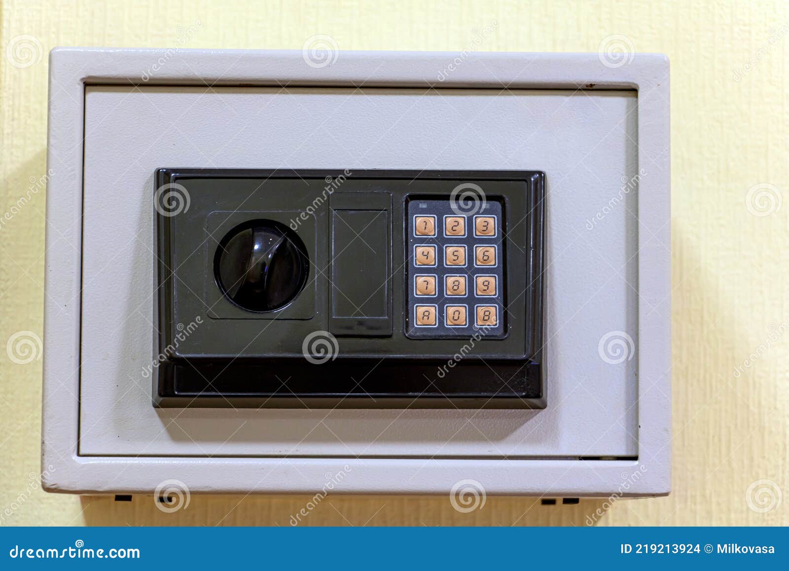 A Small Safe with a Dial is Mounted on the Wall Stock Photo - Image of ...